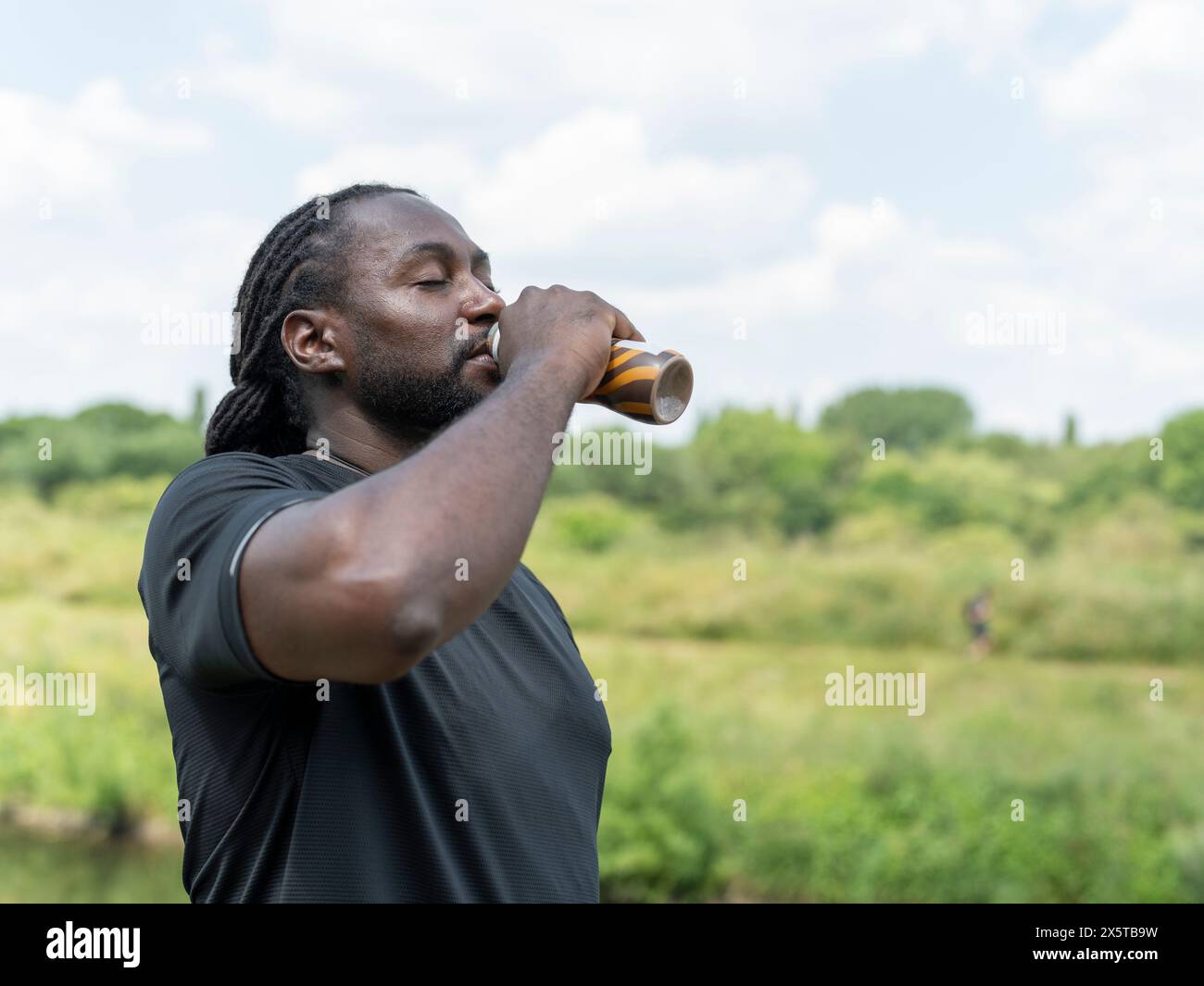 Man drinking protein drink during workout Stock Photo - Alamy