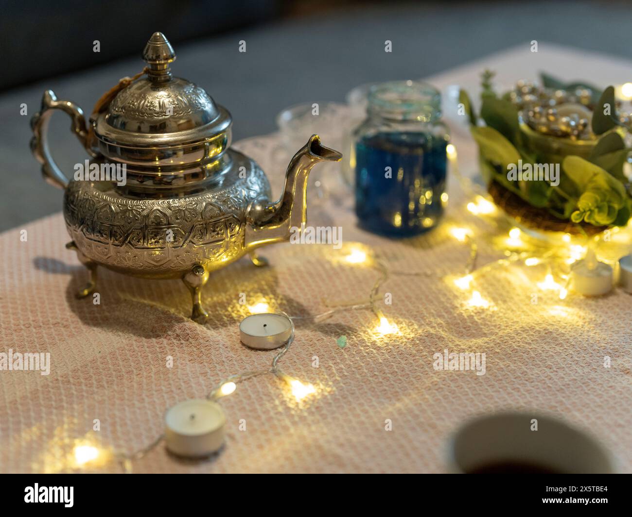 Shiny teapot on decorated table during Ramadan Stock Photo - Alamy