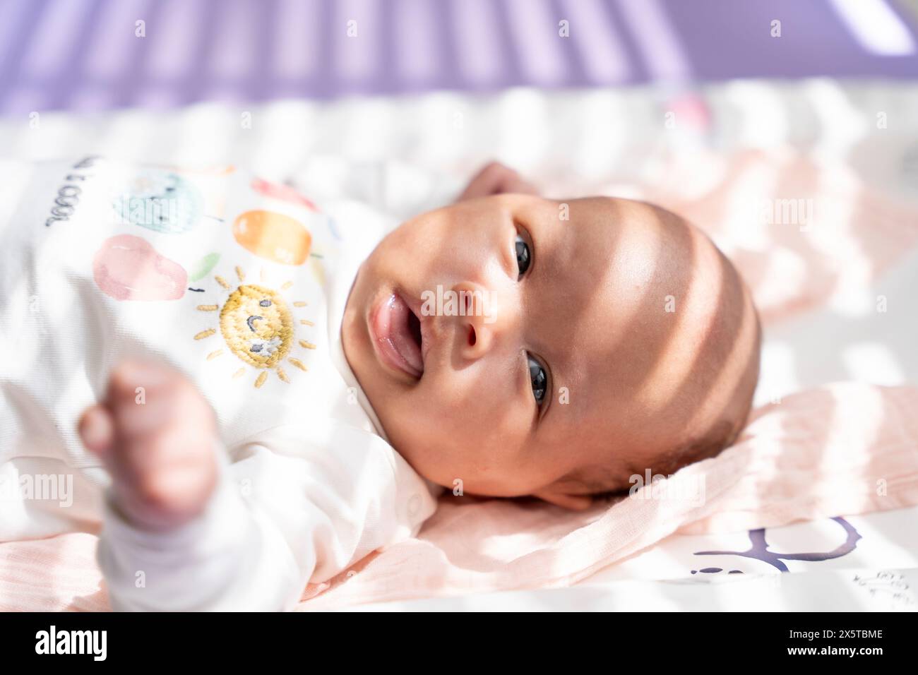 Portrait of newborn baby girl lying on back Stock Photo - Alamy