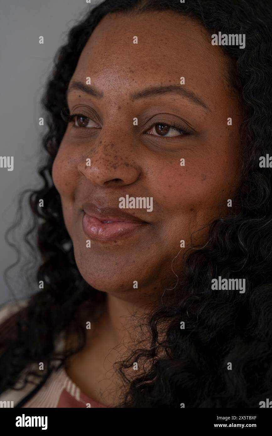 Portrait of brunette woman with dimples Stock Photo - Alamy