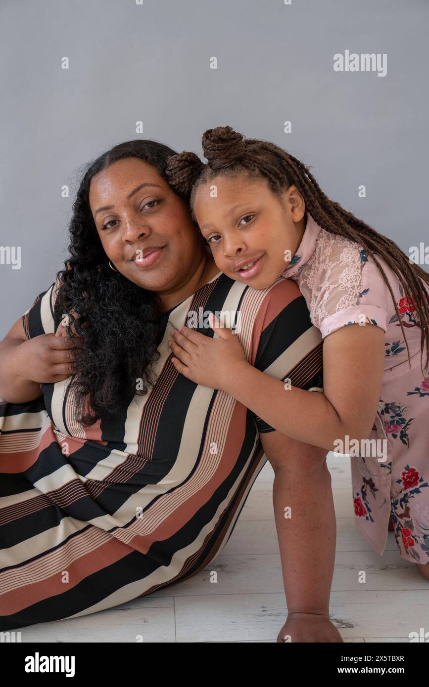 Family daughter sitting kneeling hi-res stock photography and images ...