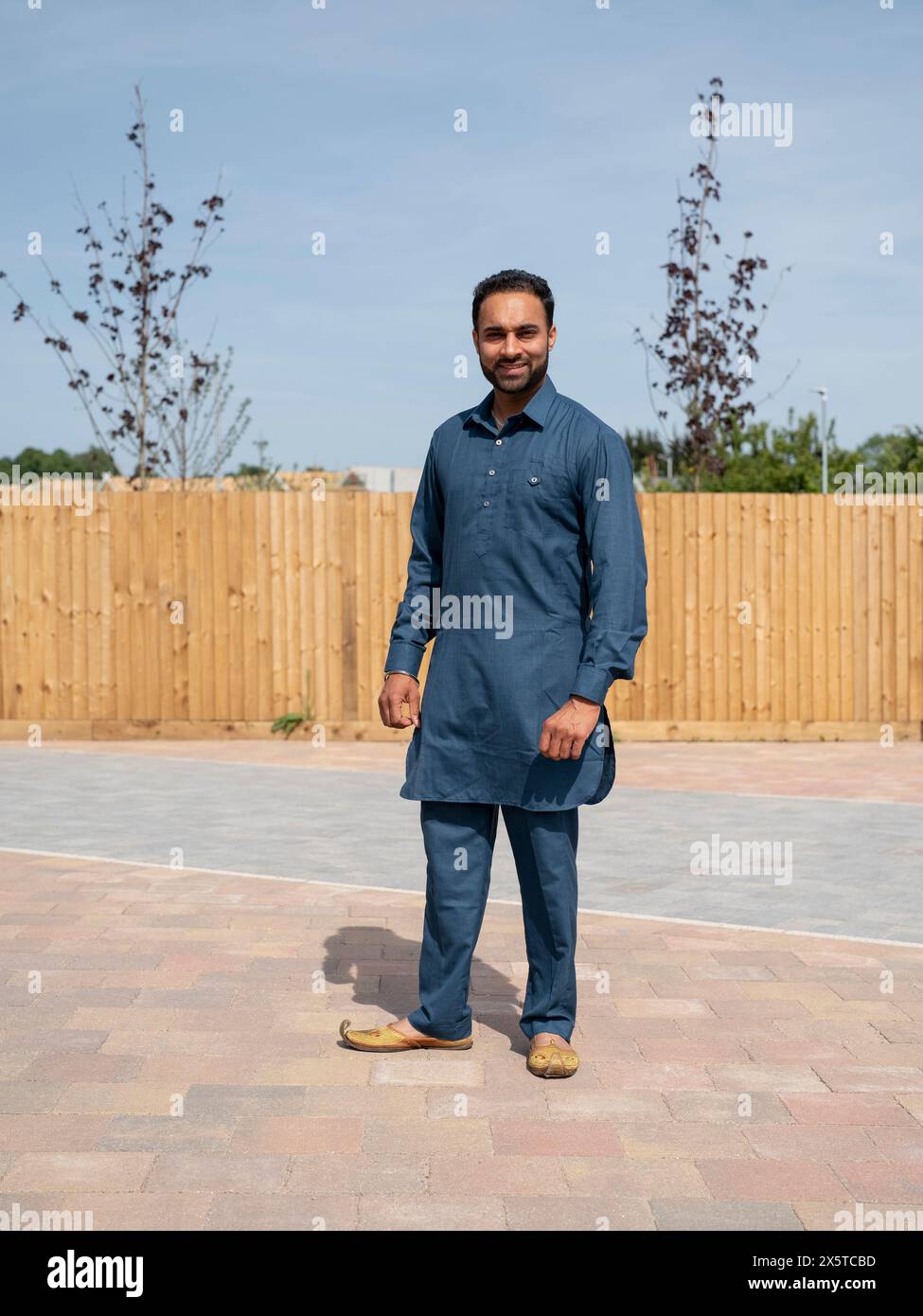 Portrait of smiling man in traditional clothing Stock Photo - Alamy