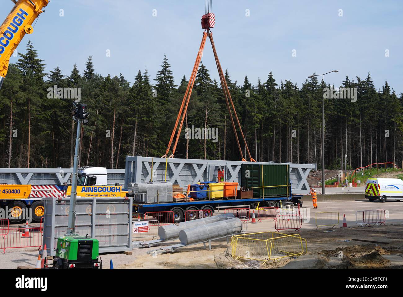 A gantry is attached to a crane during engineering works at the A3 ...