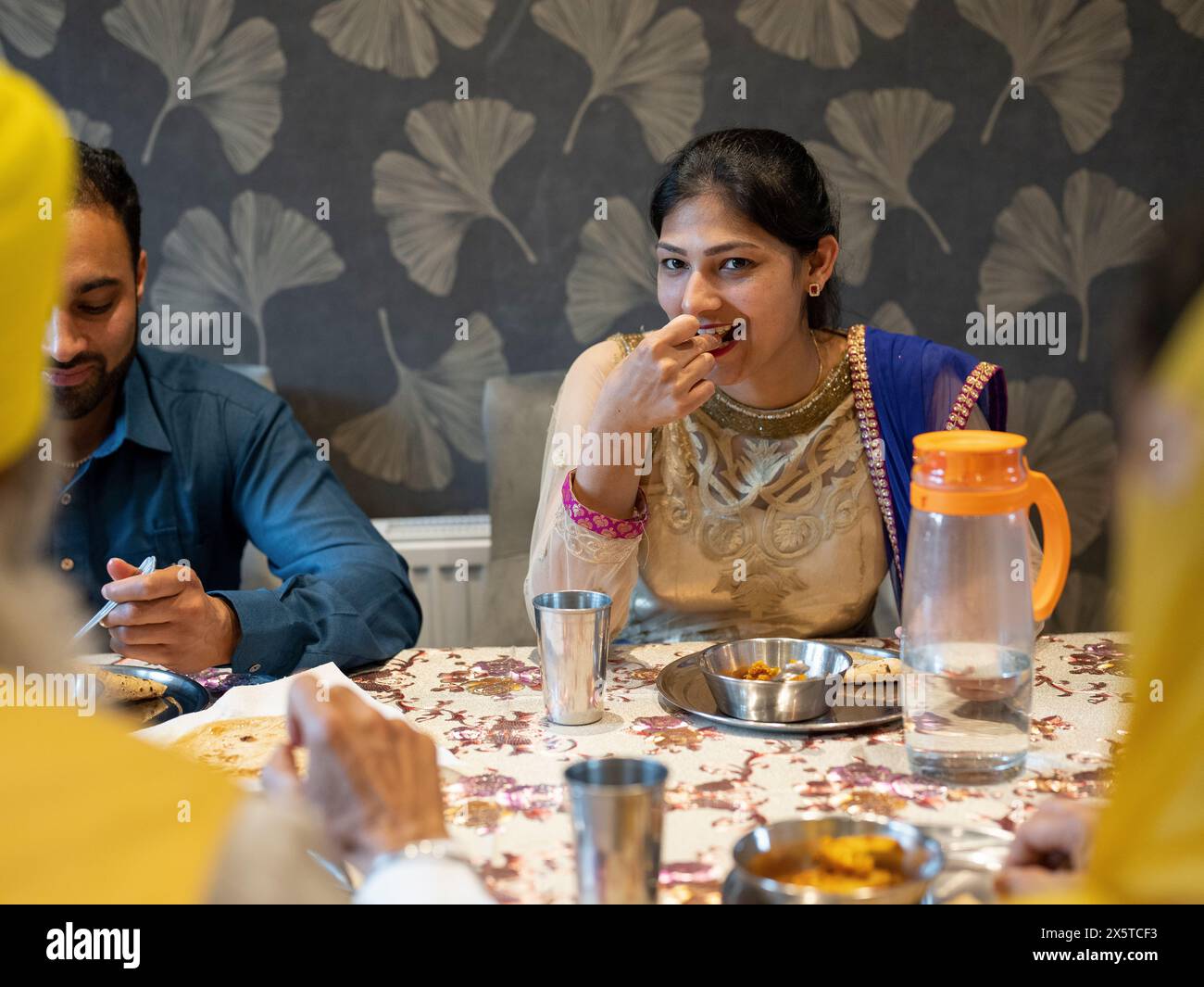Family eating traditional Indian food at home Stock Photo - Alamy