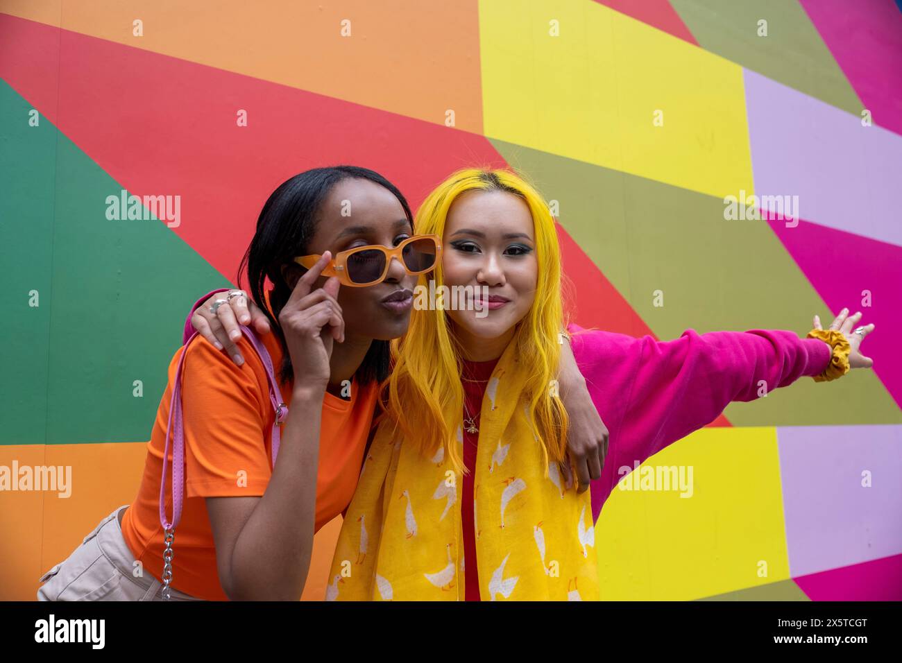 Smiling female friends making hi-res stock photography and images - Alamy