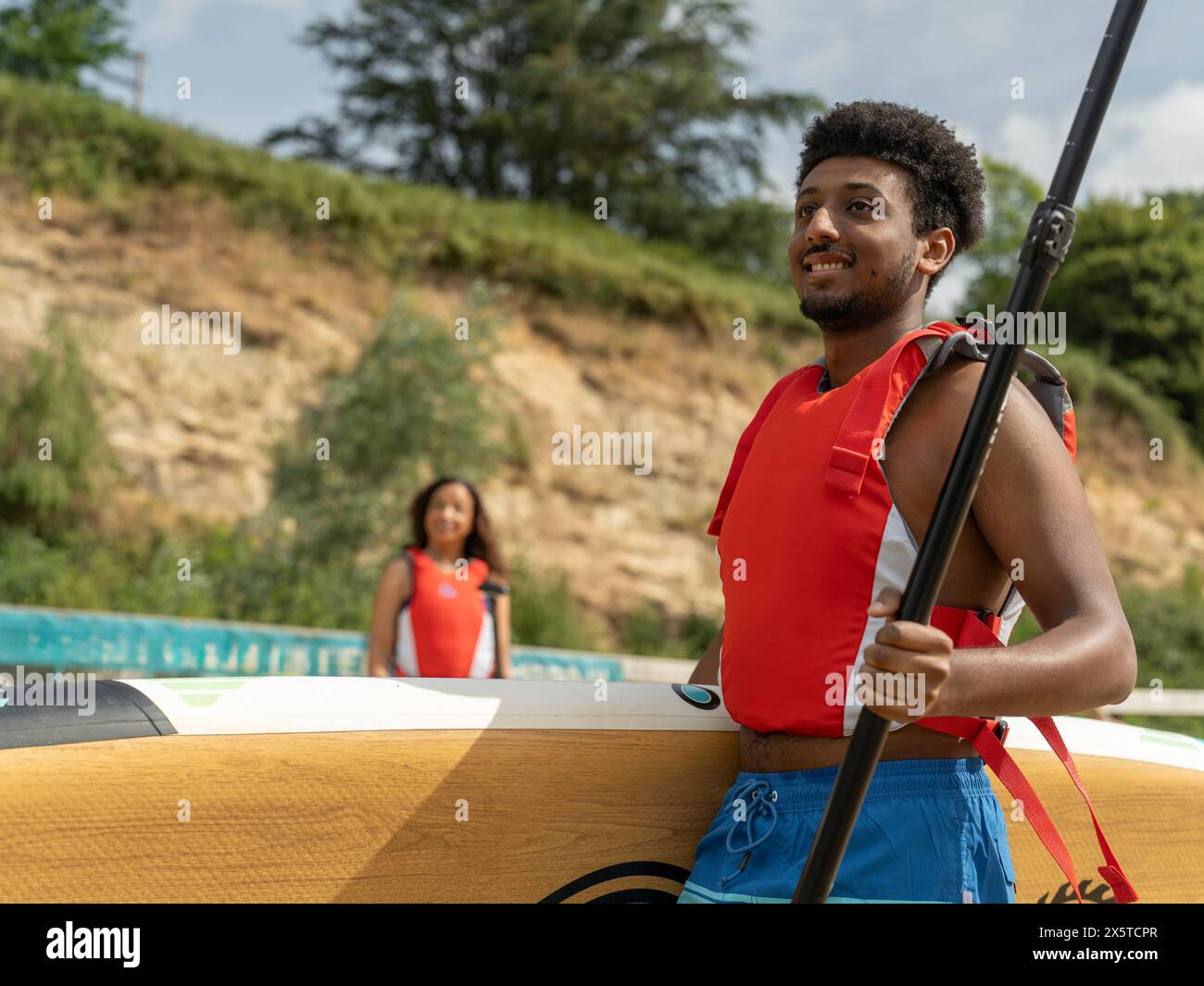 Man carrying woman beach hi-res stock photography and images - Alamy