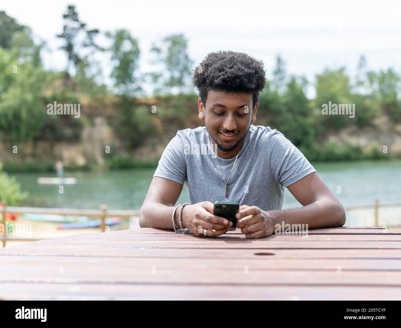 Handsome young cheerful man using hi-res stock photography and images ...