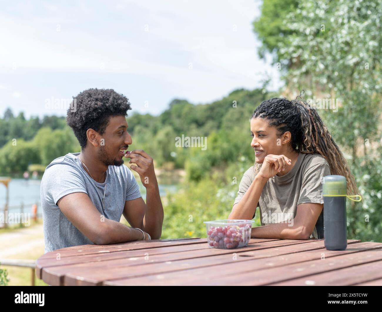 Young friends eating having picnic hi-res stock photography and images ...