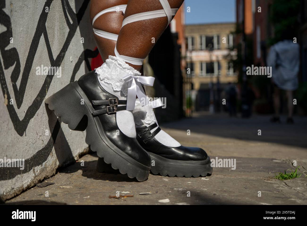 Woman wearing platform shoes and white socks Stock Photo - Alamy