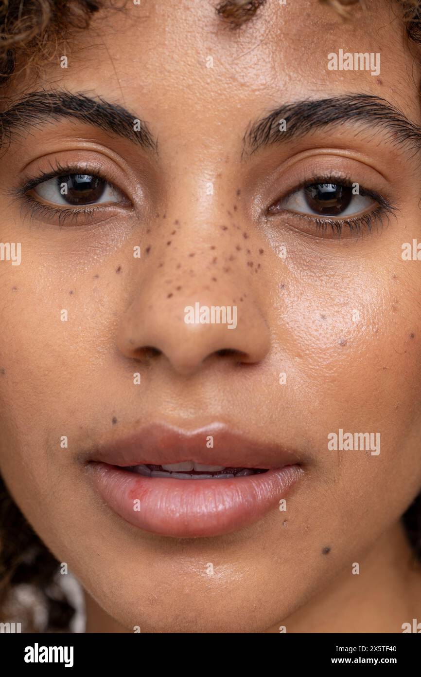 Portrait pf woman with brown eyes and freckles looking at camera Stock ...