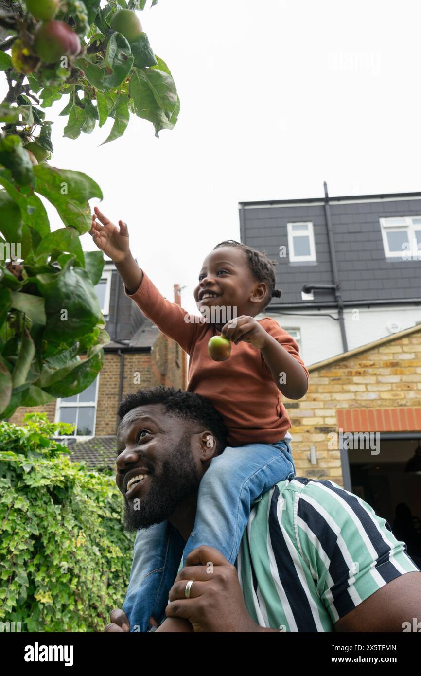 African child apple tree hi-res stock photography and images - Alamy