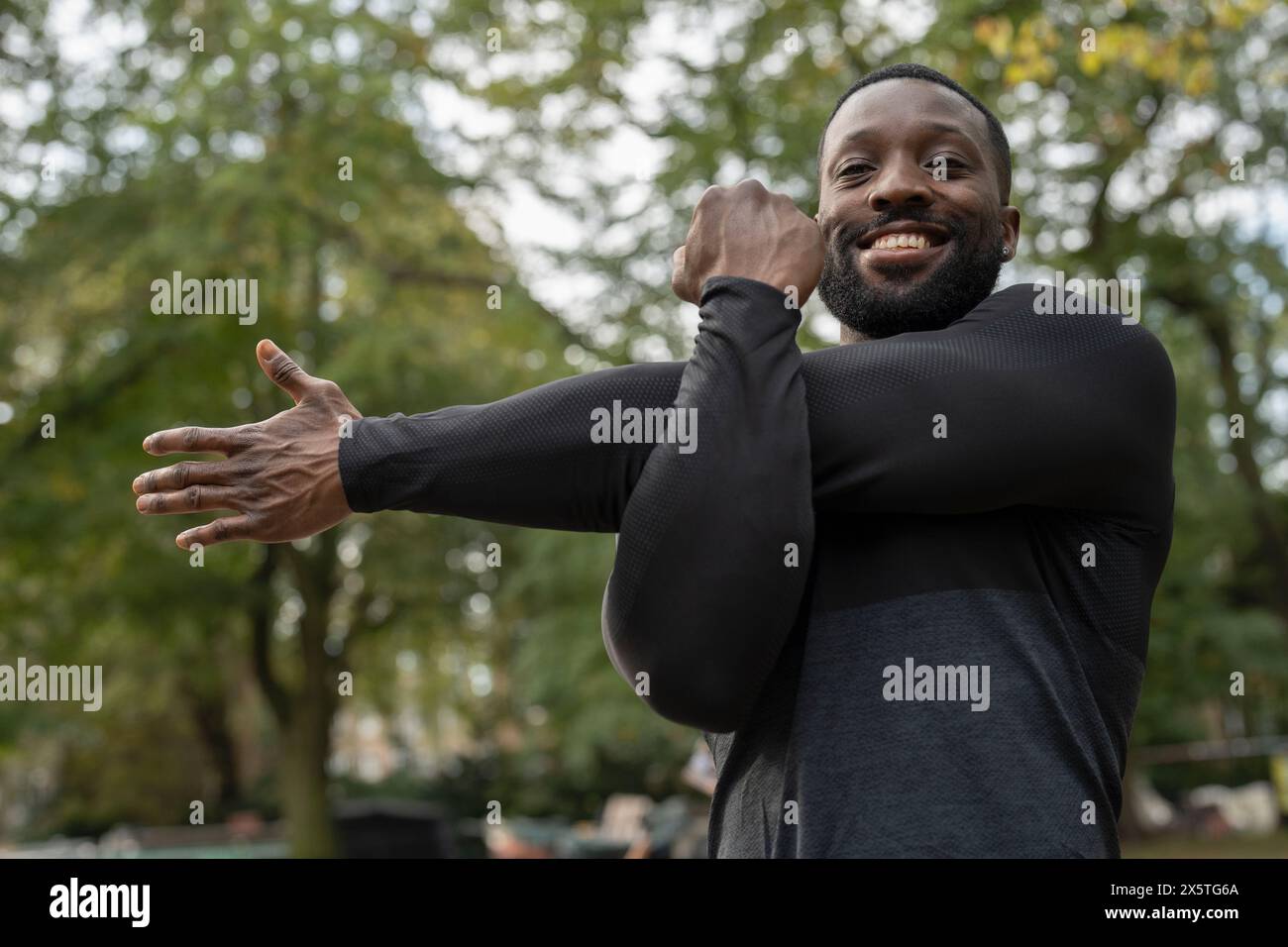Man training stretching arm hi-res stock photography and images - Alamy