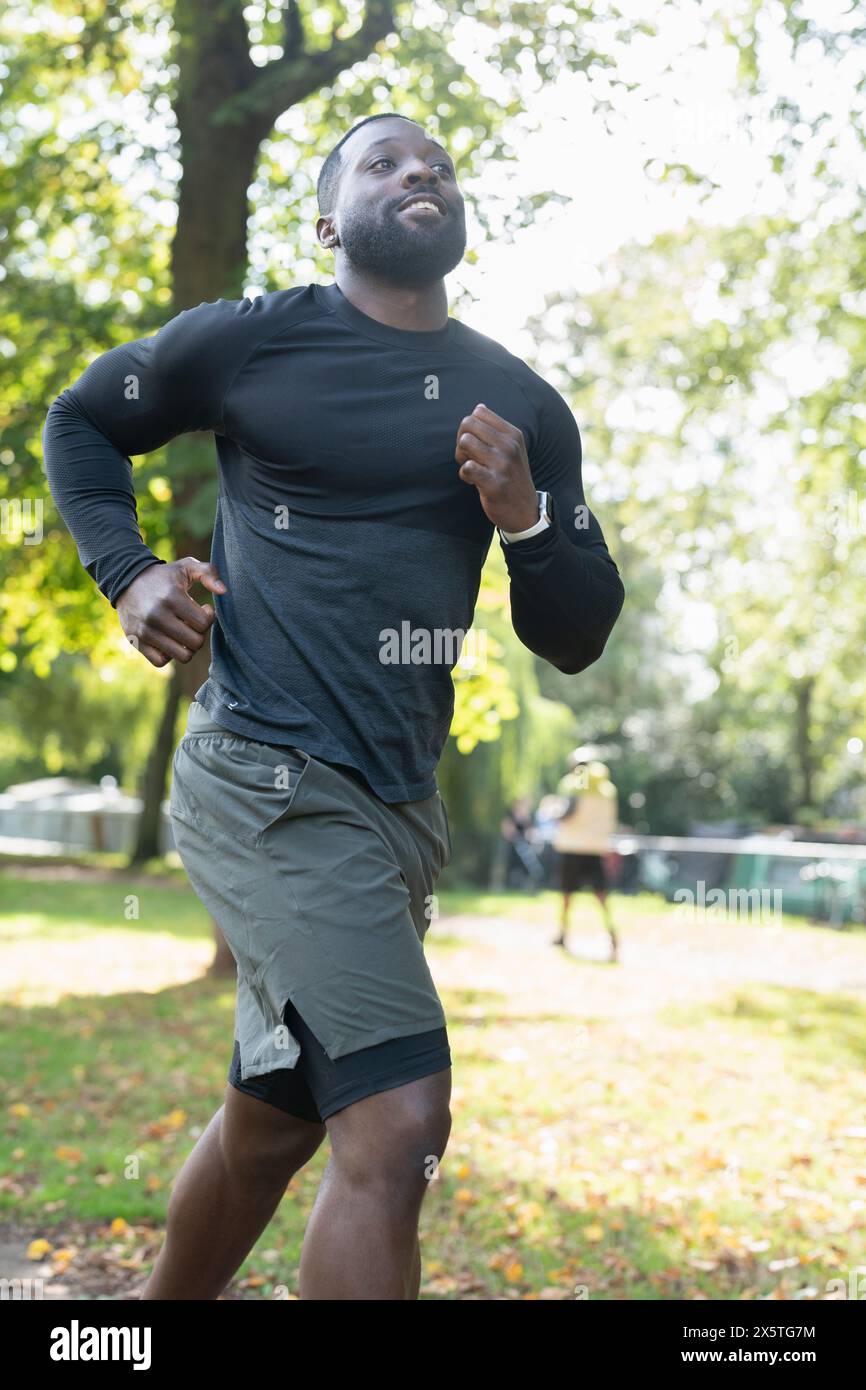 Man running watch park hi-res stock photography and images - Alamy