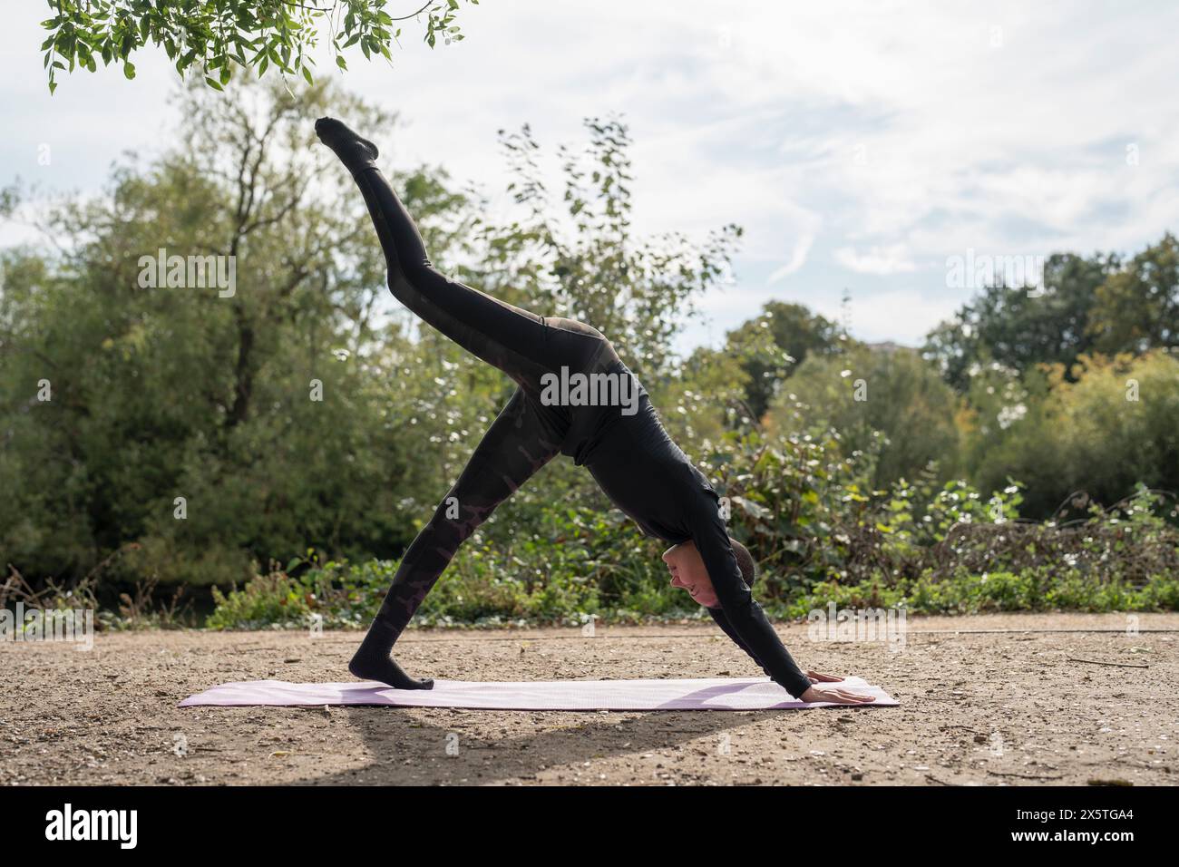 Athlete practicing downward facing hi-res stock photography and images ...
