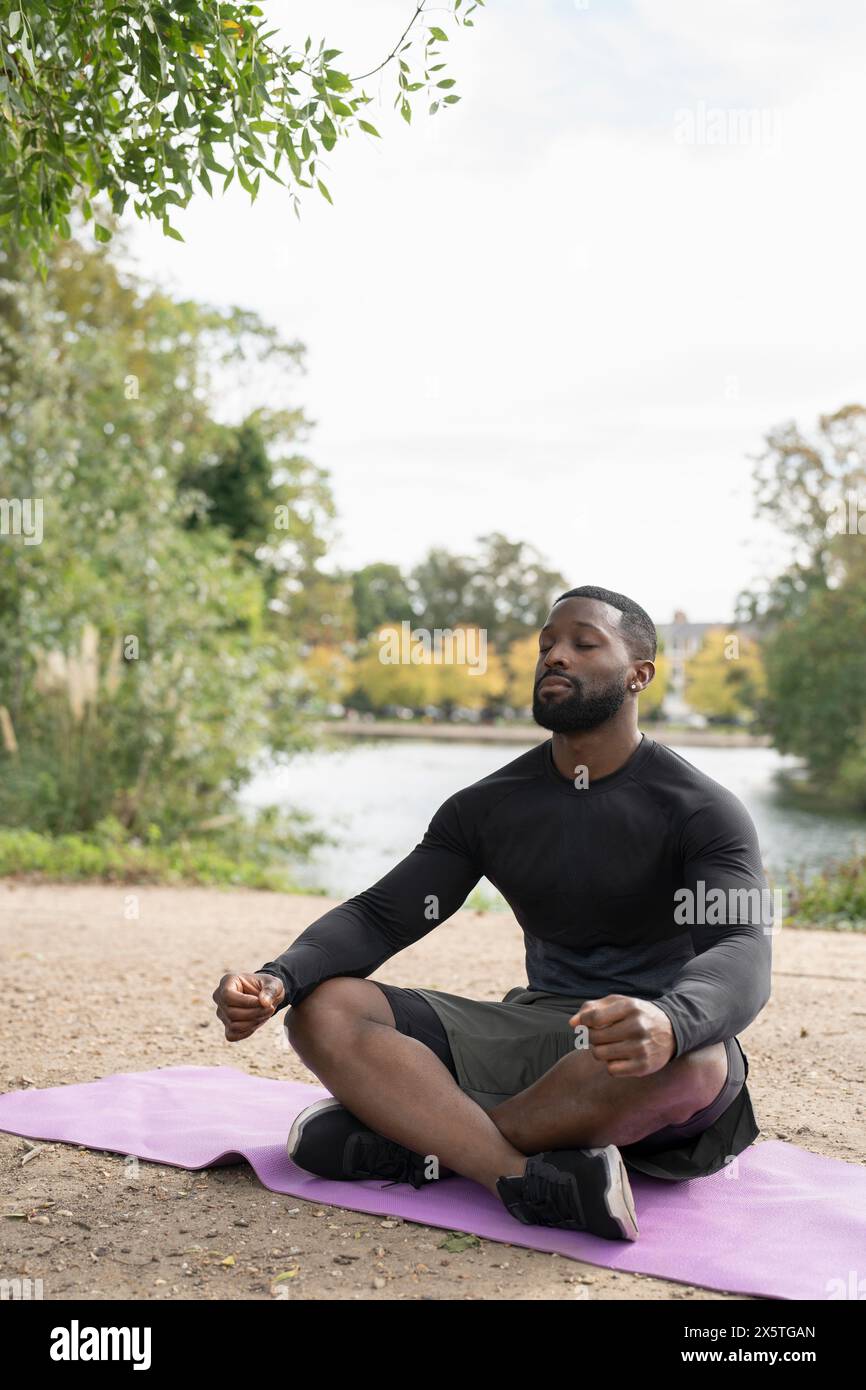 Man meditating hi-res stock photography and images - Alamy