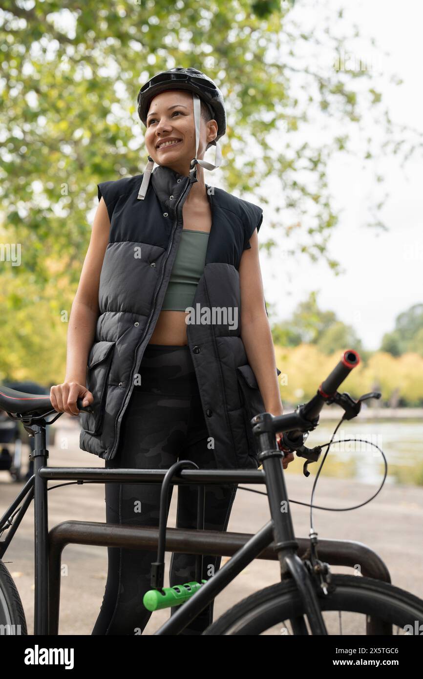 Smiling woman in safety vest hi-res stock photography and images - Alamy
