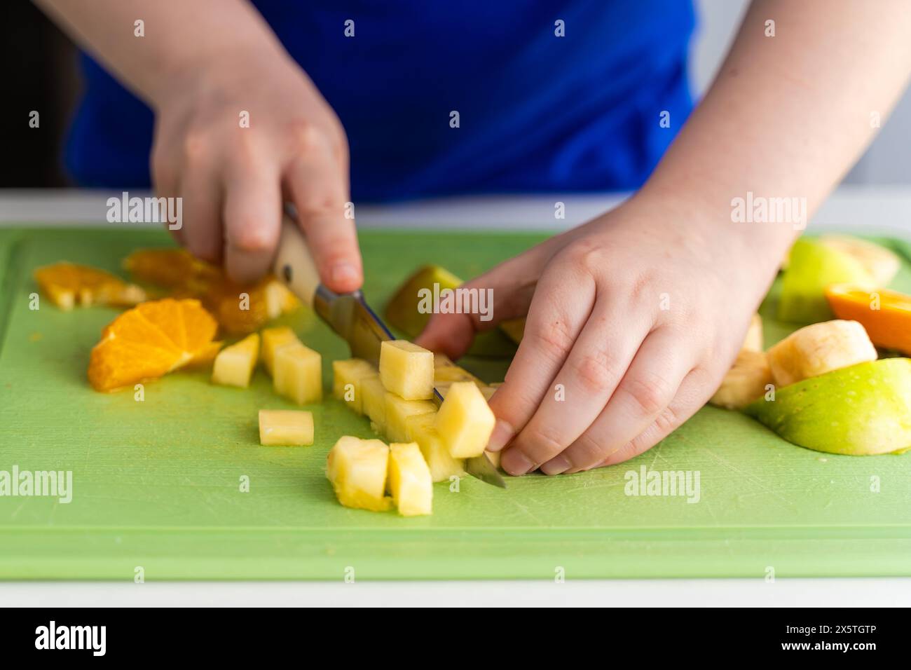 Girls hands cutting fruit hi-res stock photography and images - Alamy