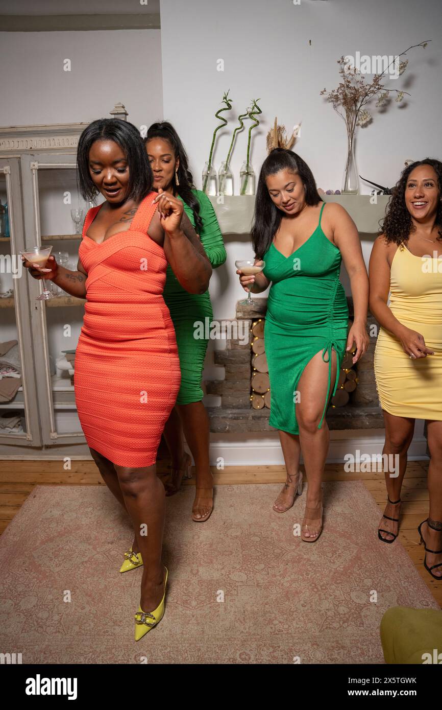 Women dancing during party at home Stock Photo - Alamy