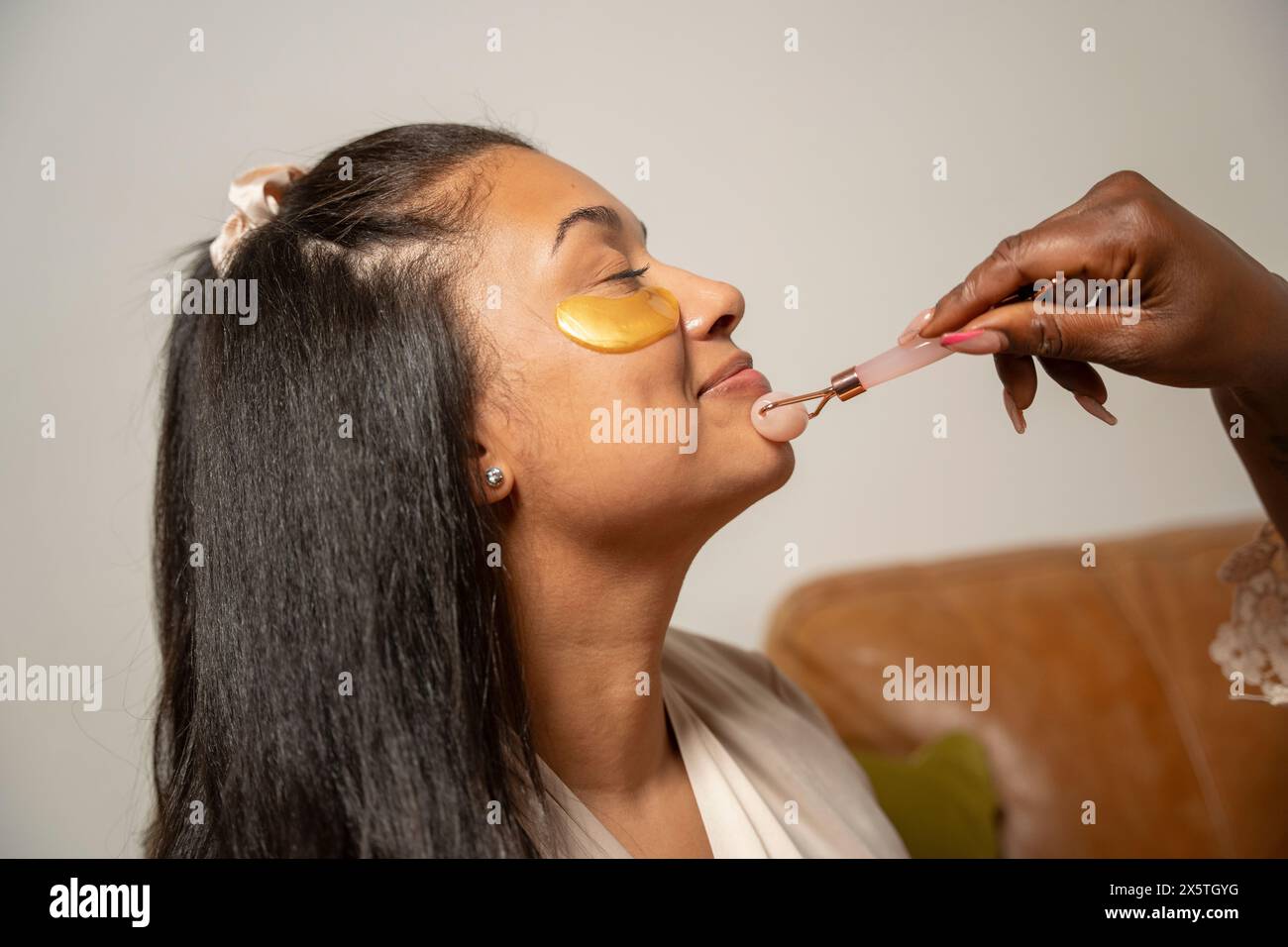 Friends making cosmetic procedures to each other Stock Photo - Alamy