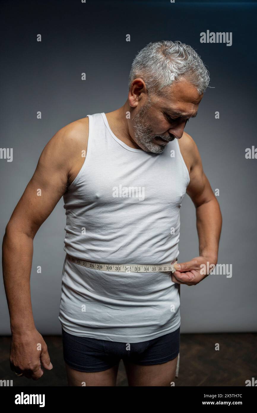 Measuring tape on gray hi-res stock photography and images - Alamy