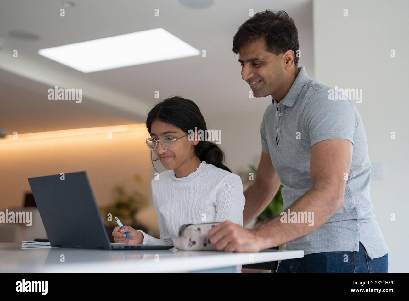 Asian father helping daughter homework hi-res stock photography and images - Alamy