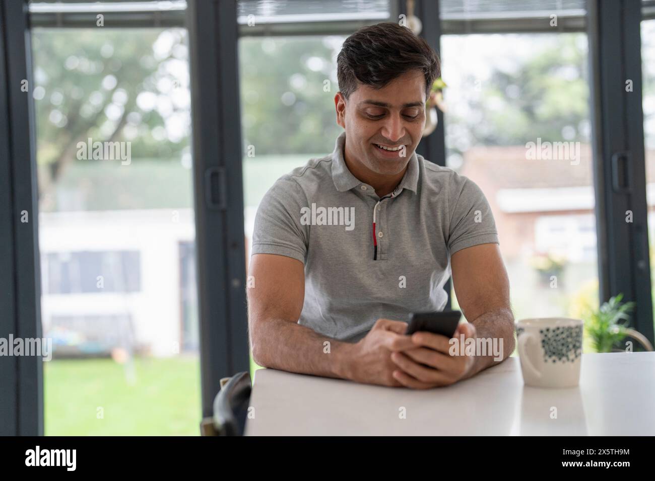 Man sitting table using hi-res stock photography and images - Alamy