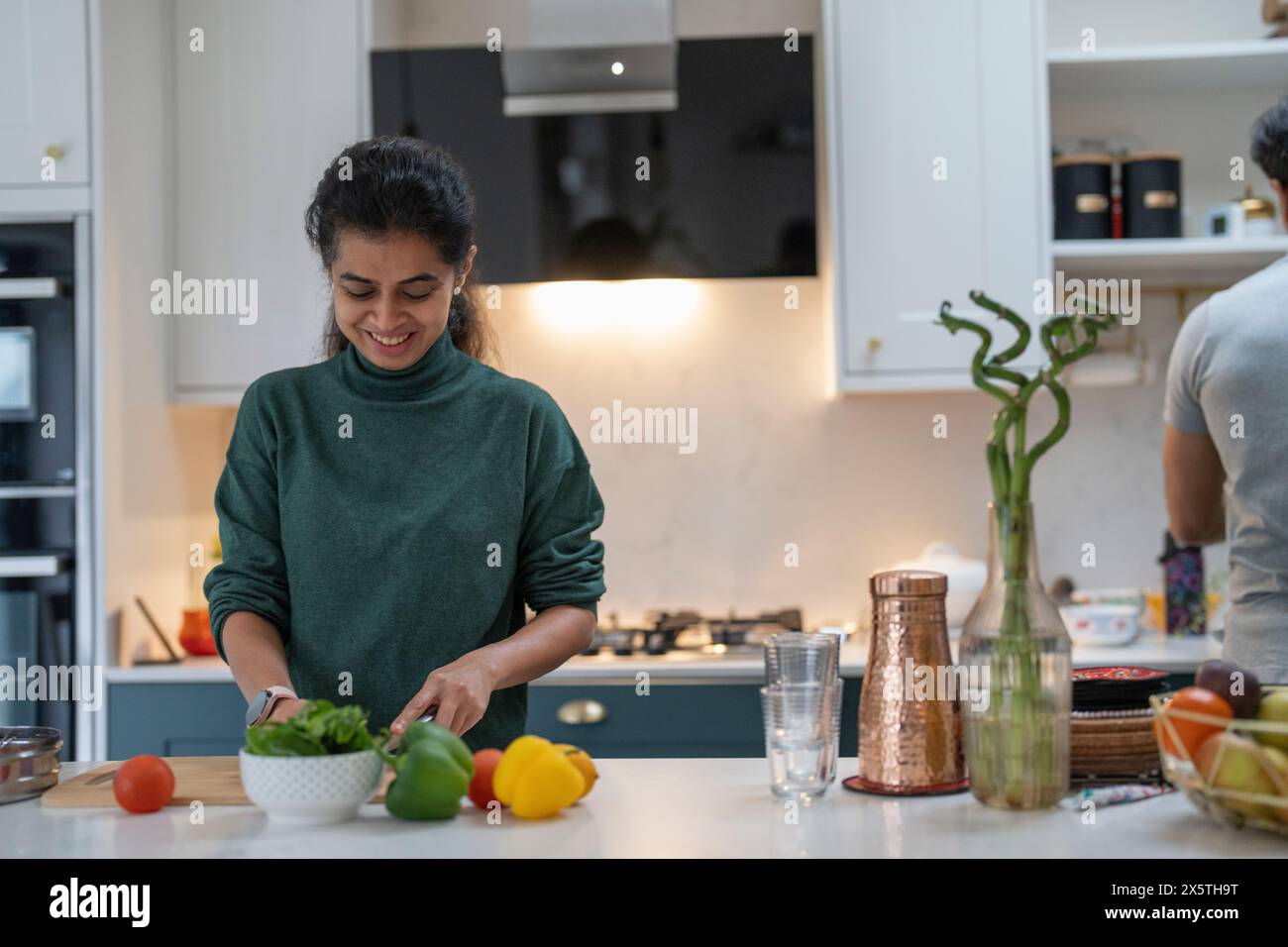 Woman preparing food in kitchen Stock Photo - Alamy