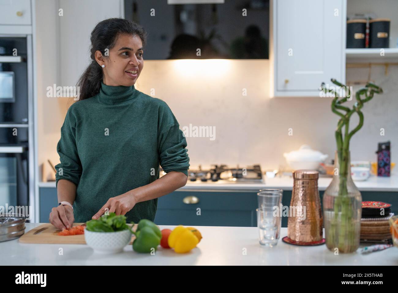 Woman preparing food in kitchen Stock Photo - Alamy