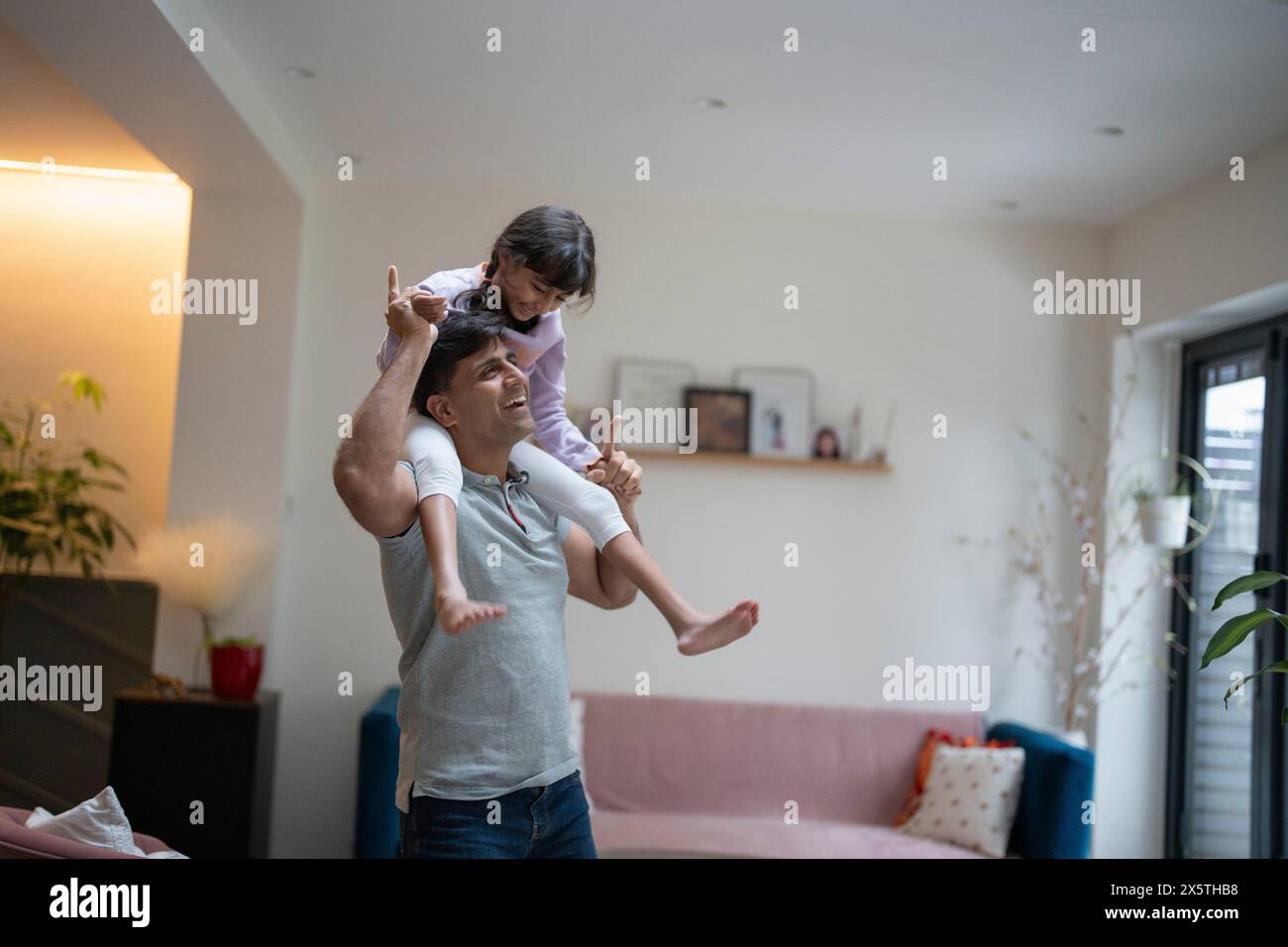 Father carrying child on shoulders hi-res stock photography and images - Alamy