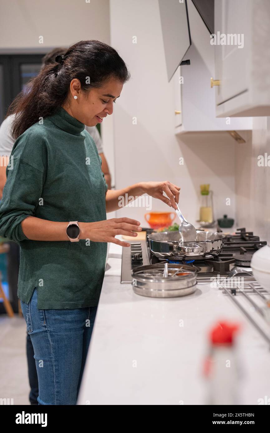 Indian woman cooking kitchen home hi-res stock photography and images ...