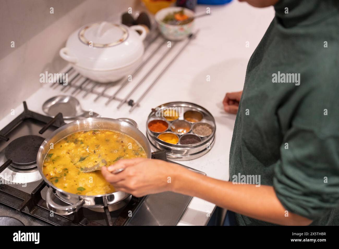 Woman cooking at home Stock Photo - Alamy