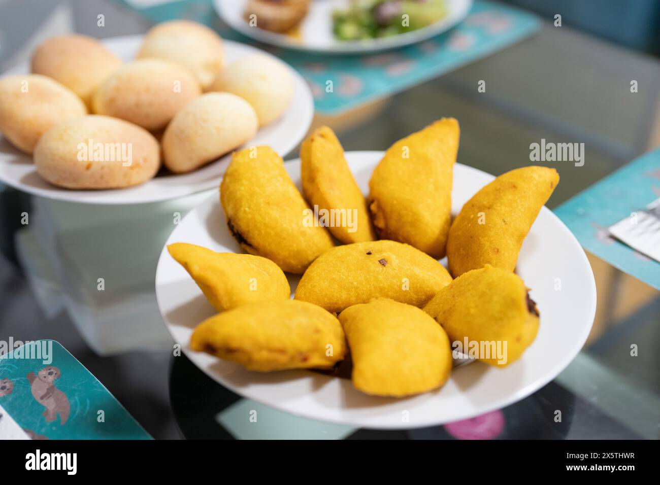 Plate of fresh empanadas on dining table Stock Photo - Alamy