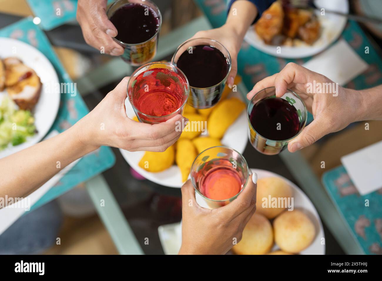 Family raising a toast over lunch Stock Photo - Alamy