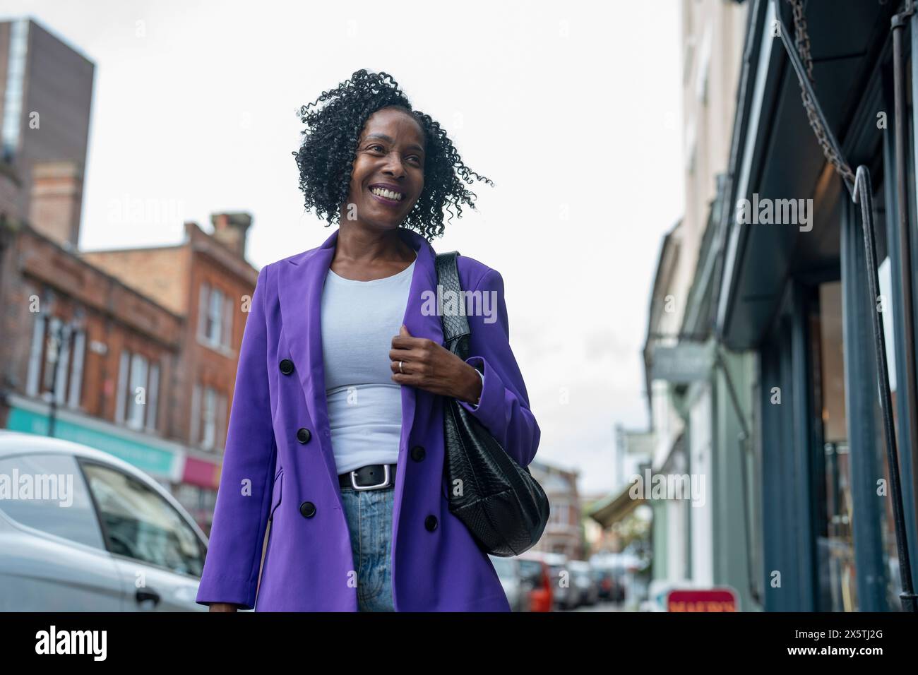 Beautiful african woman purple hi-res stock photography and images - Alamy