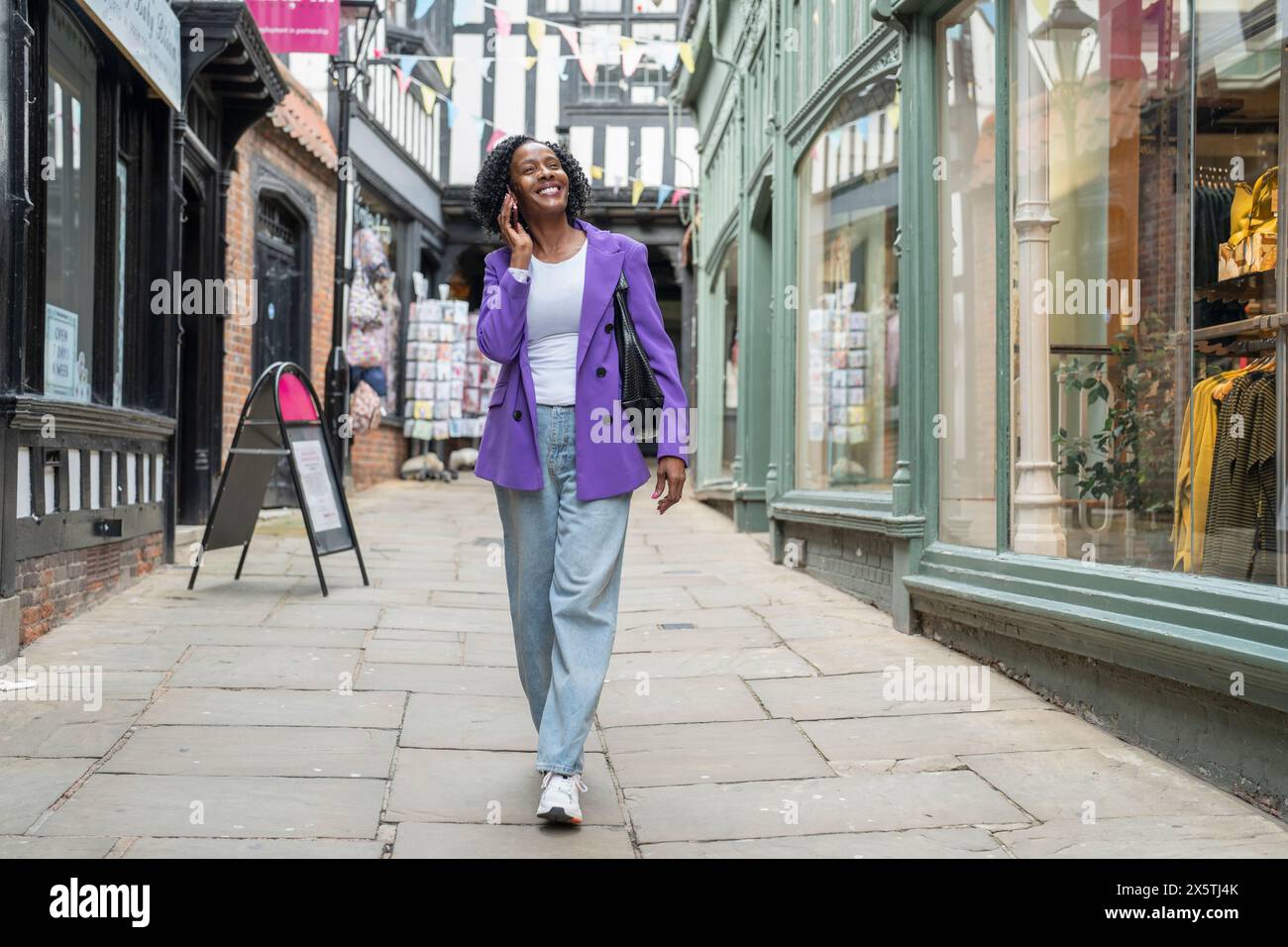 Smiling woman talking walking hi-res stock photography and images - Alamy
