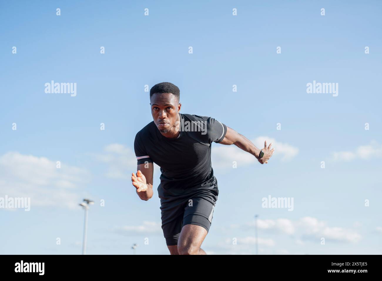 Portrait of athlete during sprint Stock Photo - Alamy