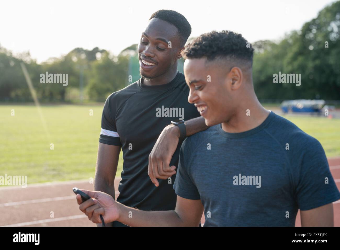 Two young men checking hi-res stock photography and images - Alamy