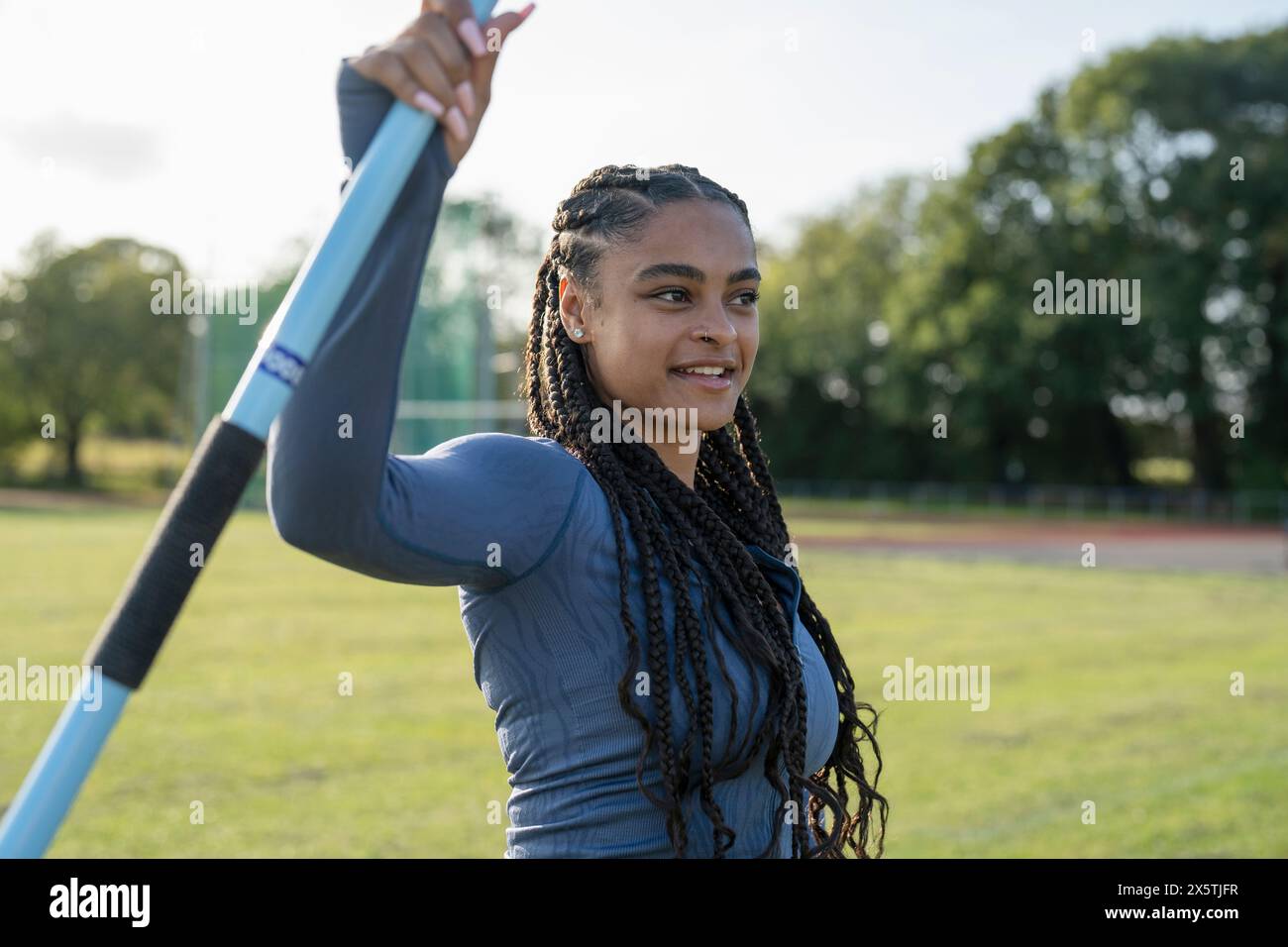 Portrait of confident female athlete holding javelin Stock Photo - Alamy Portrait of confident female athlete holding javelin Stock Photo - Alamy