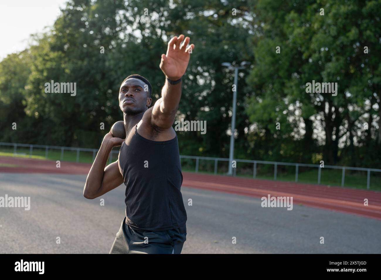 Portrait of shot putter preparing to throw Stock Photo - Alamy