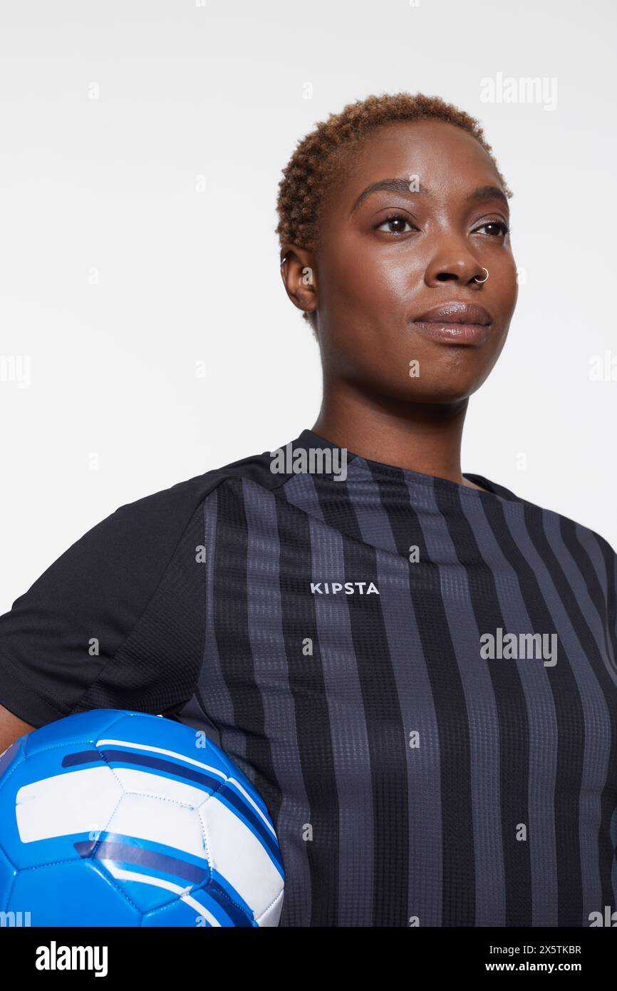 Portrait female football player standing hi-res stock photography and ...