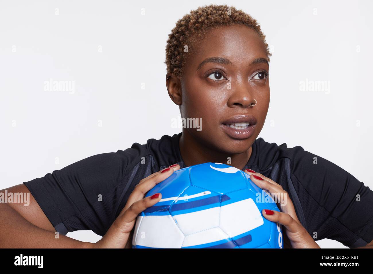 Portrait female football player standing hi-res stock photography and ...