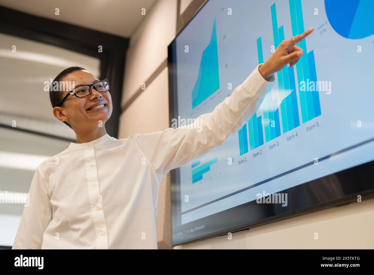 Leader making presentation in office Stock Photo - Alamy