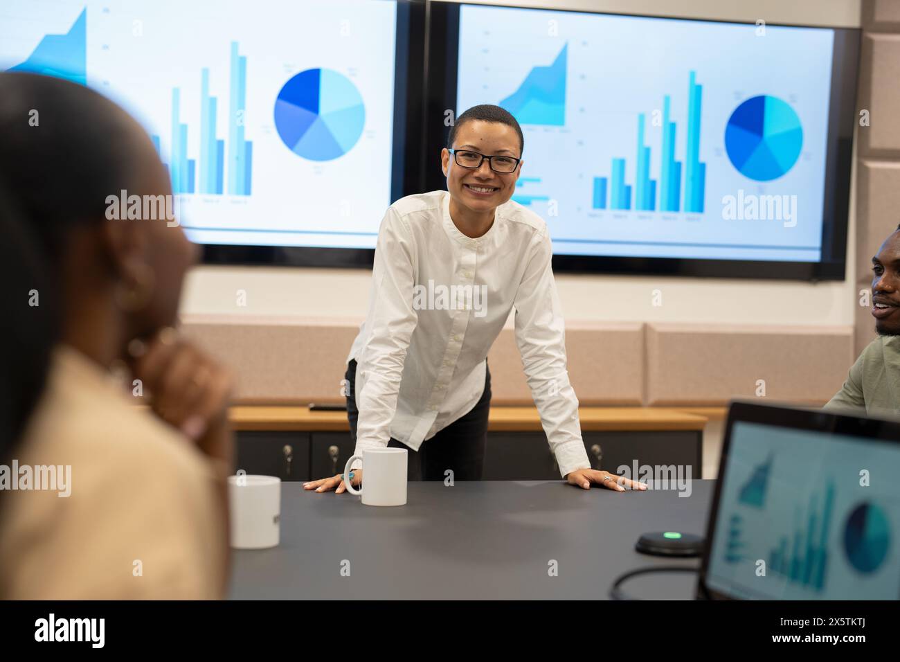 Leader making presentation in office Stock Photo - Alamy