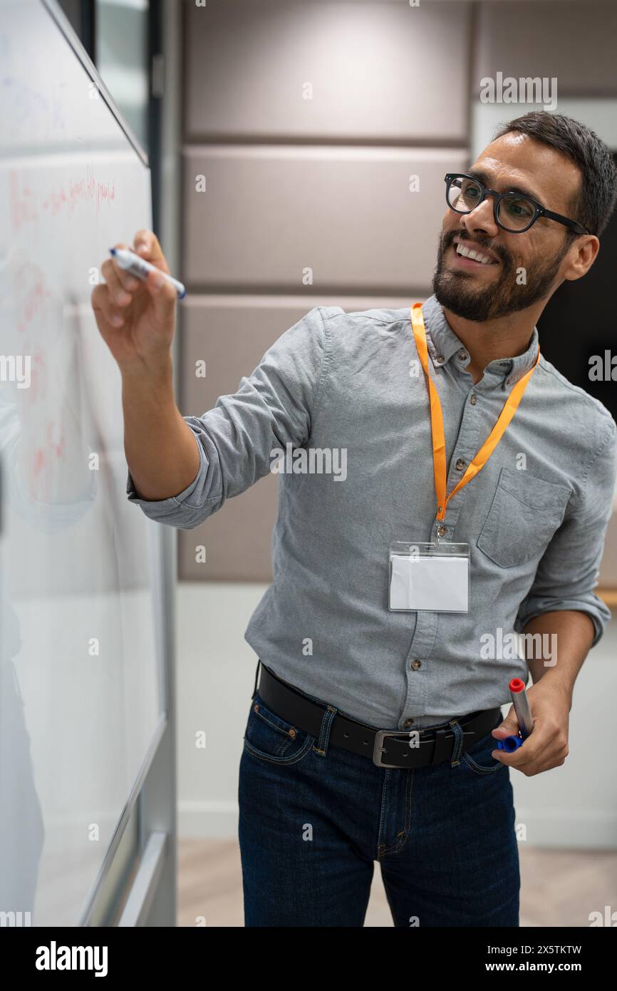 Leader making presentation in office Stock Photo - Alamy