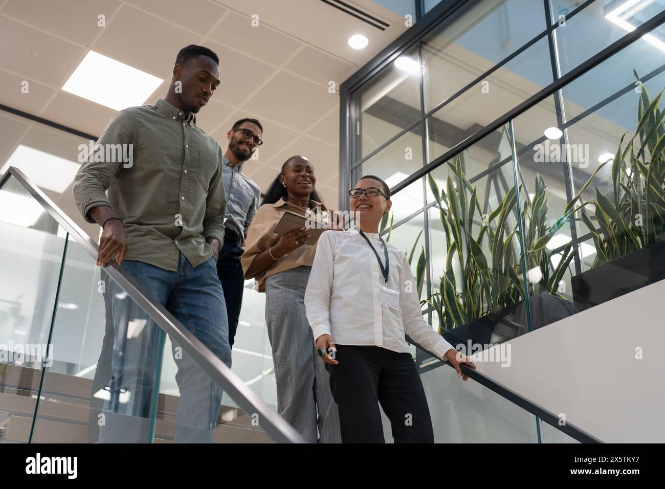 Office workers walking on steps Stock Photo - Alamy