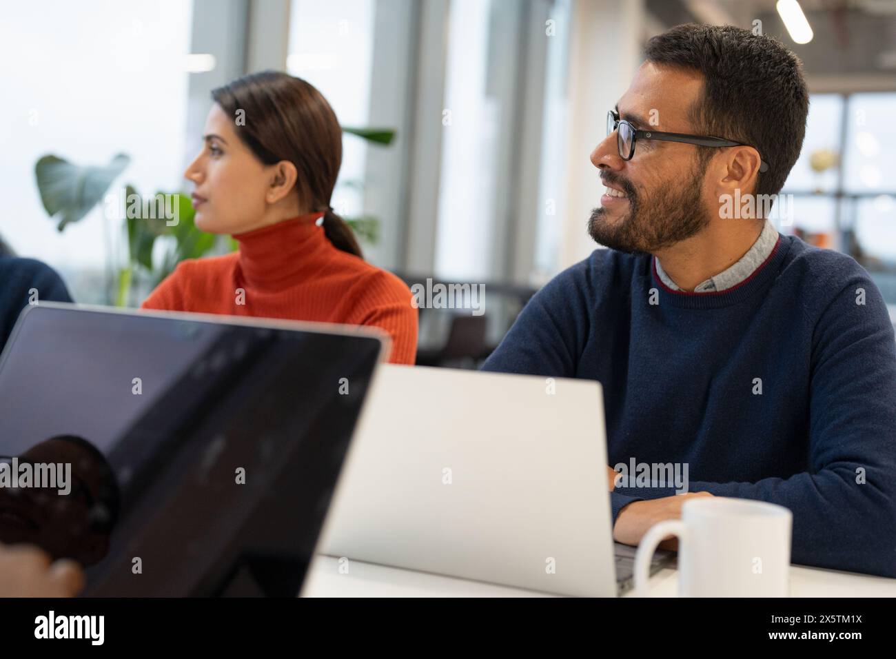 Office workers working together Stock Photo - Alamy