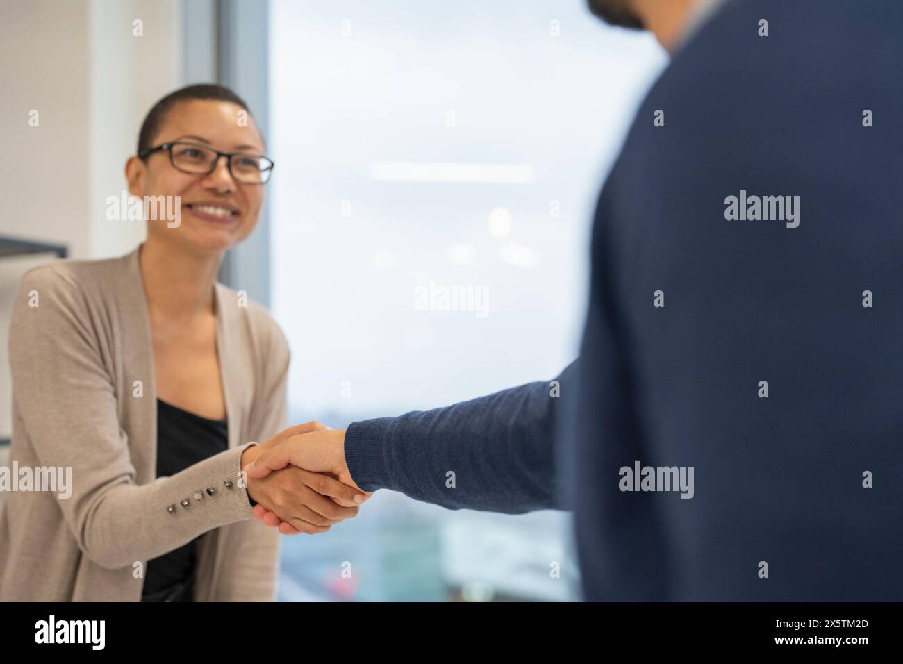 Business people greeting in office Stock Photo - Alamy