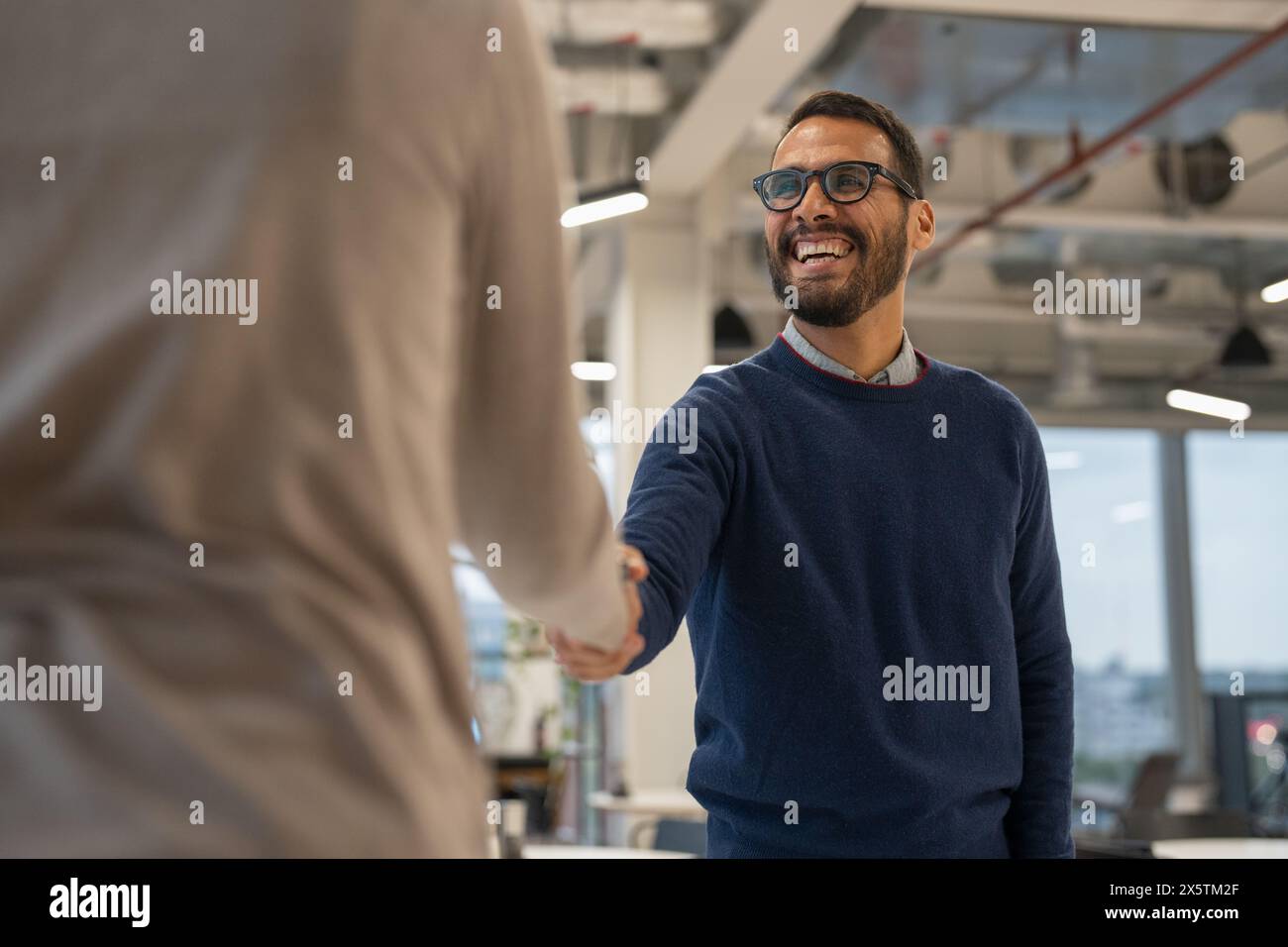 Business people greeting in office Stock Photo - Alamy