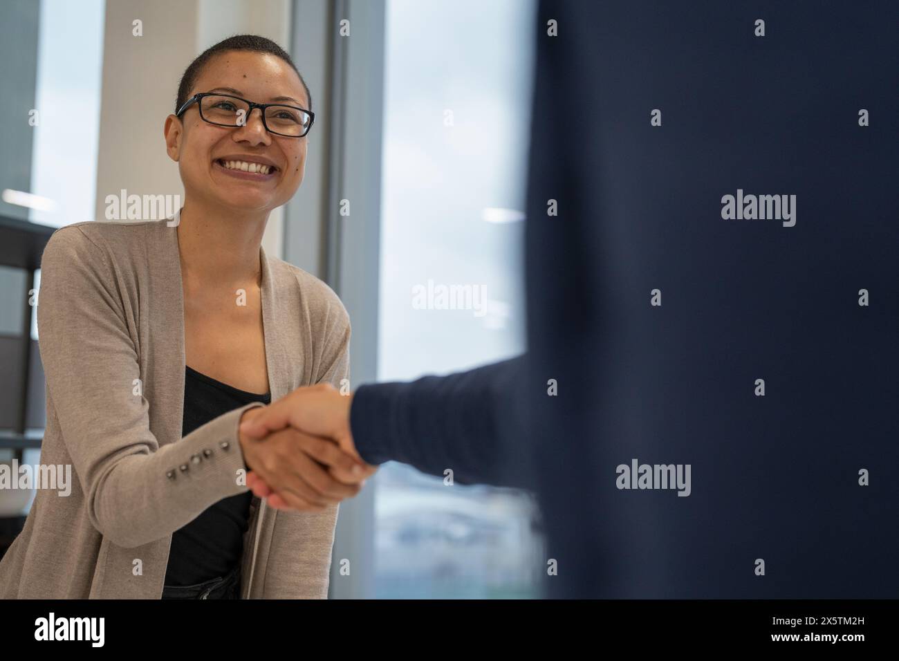 Business people greeting in office Stock Photo - Alamy