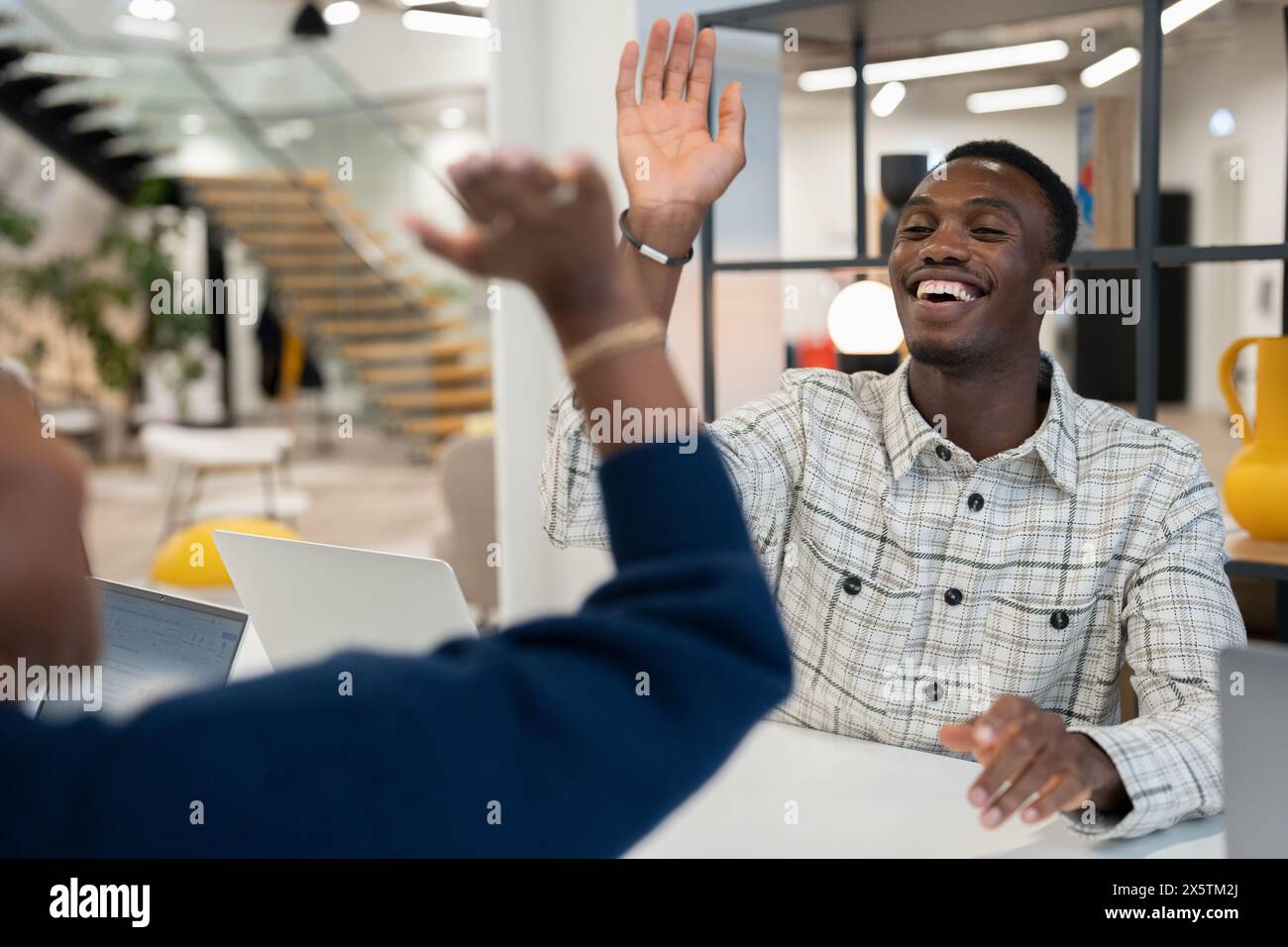 High fiving in office hi-res stock photography and images - Alamy